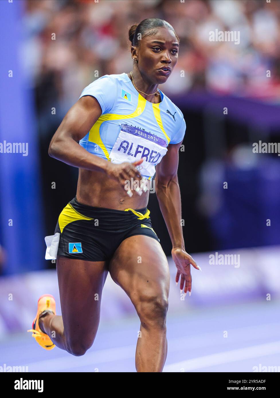 Julien Alfred participating in the 200 meters relay at the Paris 2024 ...