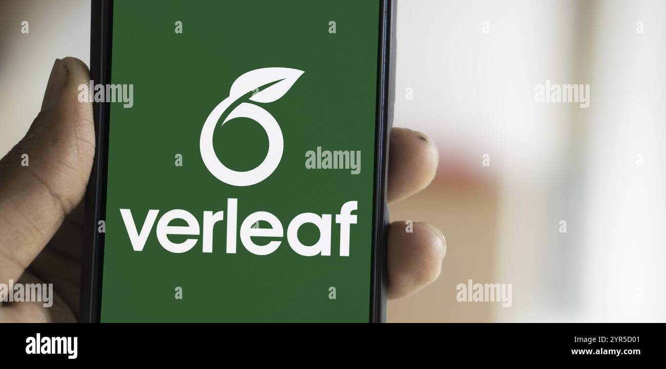 Overleaf logo is displayed on smartphone. Overleaf is a cloud-based ...
