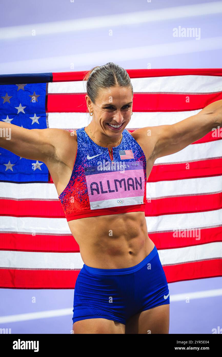Valarie Allman celebrating with her country's flag in the at the Paris ...