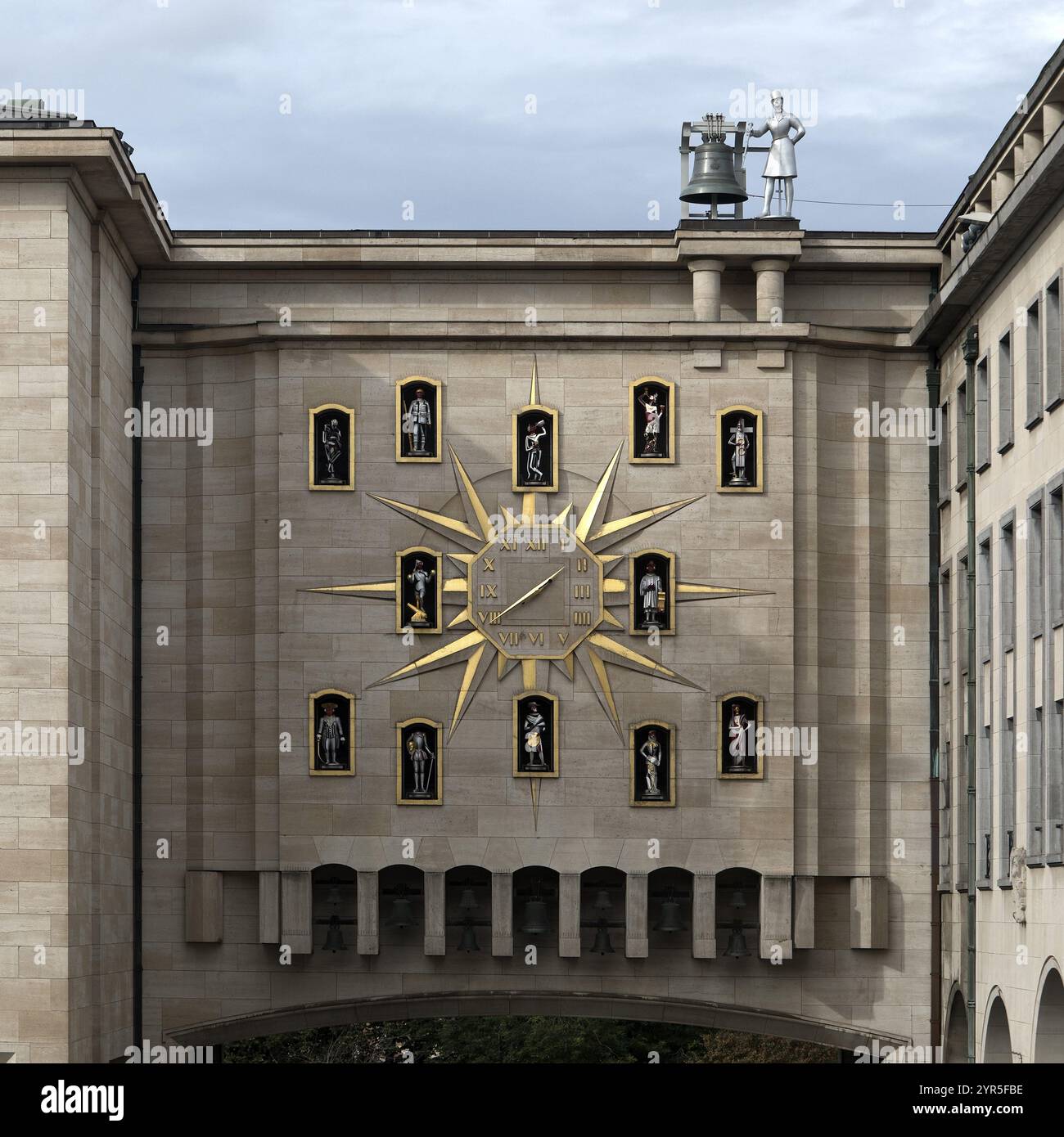 Large golden wall clock with twelve figures at the back of the Dynasty ...