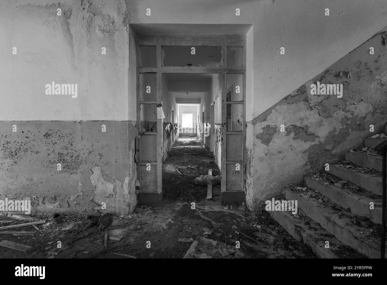 Lost Place, An abandoned and destroyed building corridor with crumbling ...