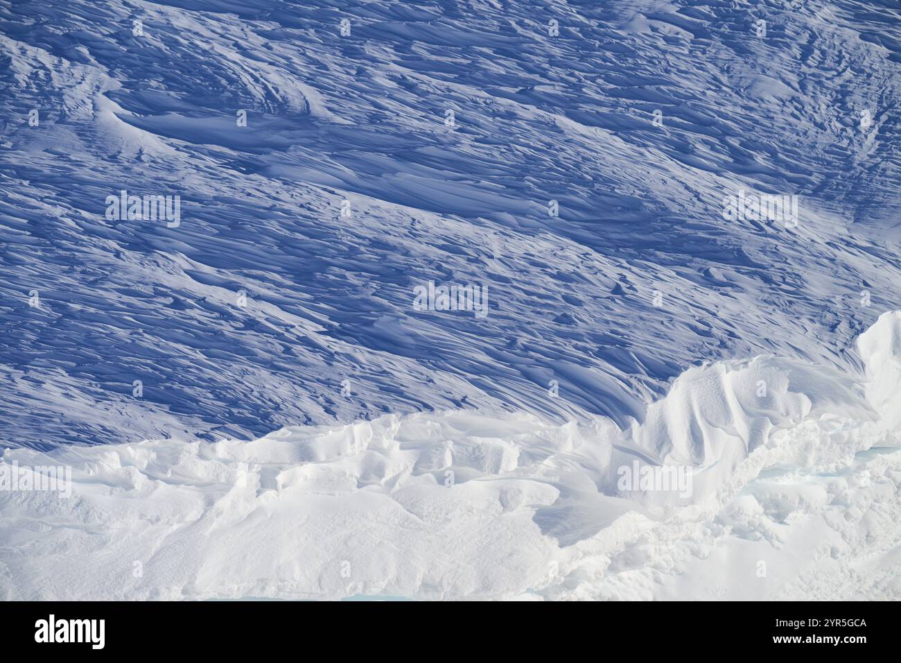 Snow-covered landscape with layers of ice and blue tones, impressive ...
