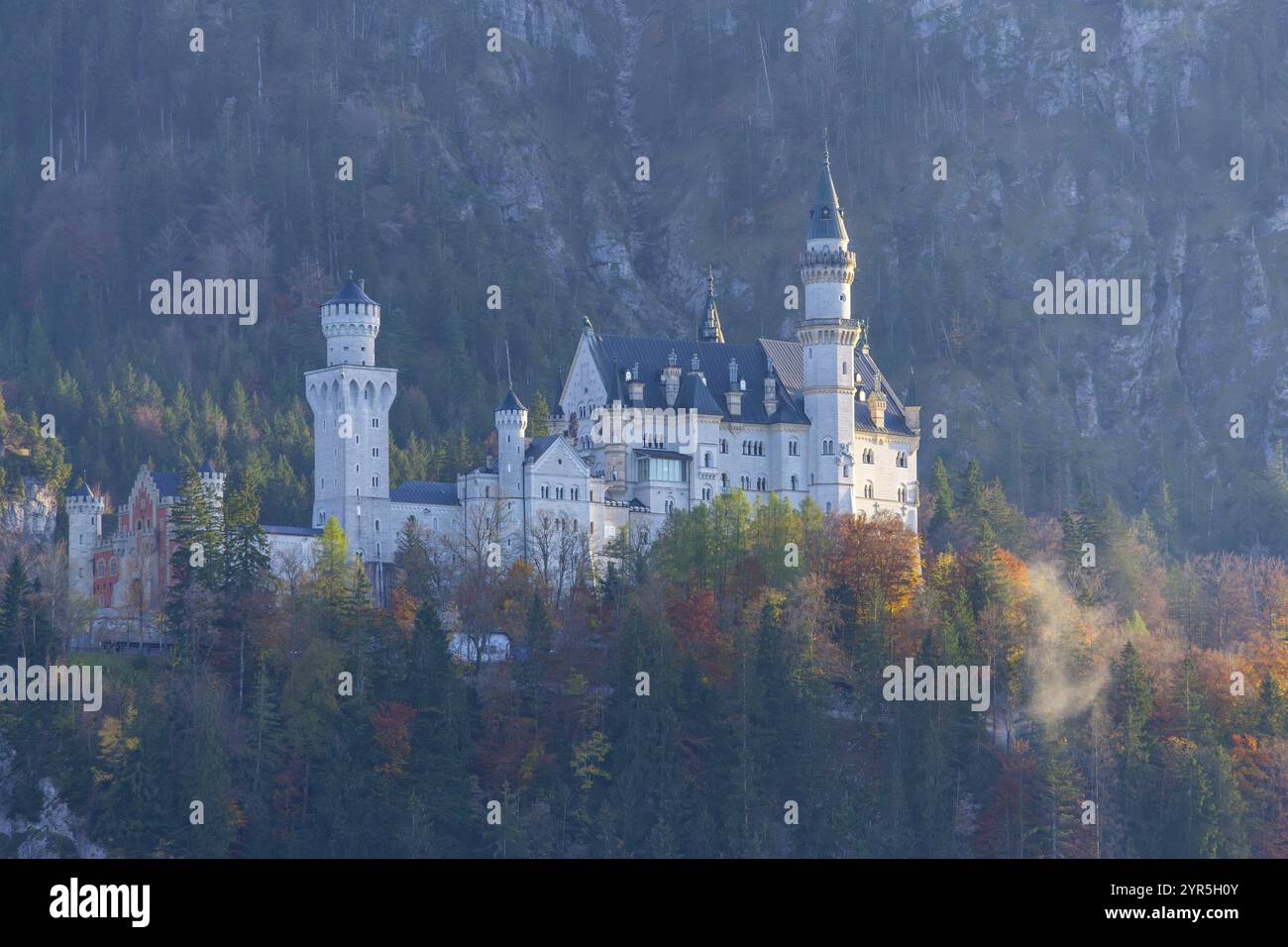 Neuschwanstein Castle in autumnal splendour, romantically embedded in ...
