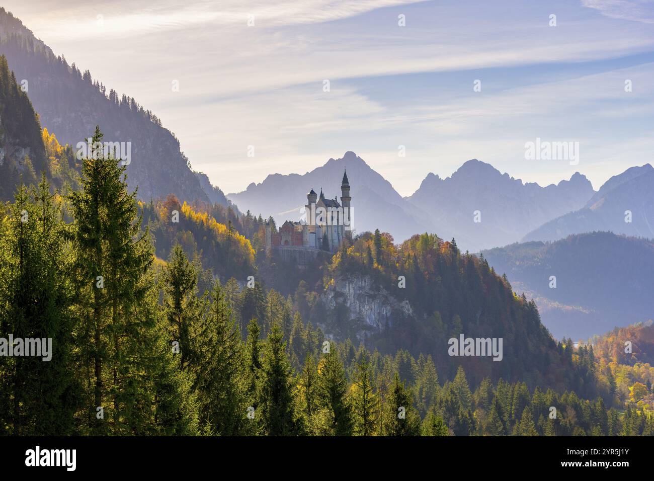 Panoramic view of Neuschwanstein Castle in front of wide mountain ...