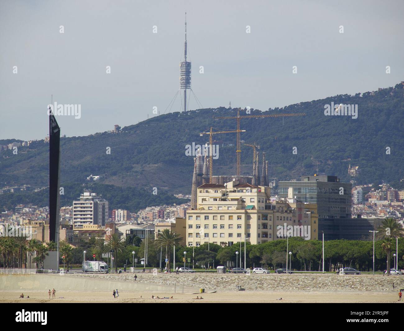City view with broadcasting tower and architecturally diverse buildings ...