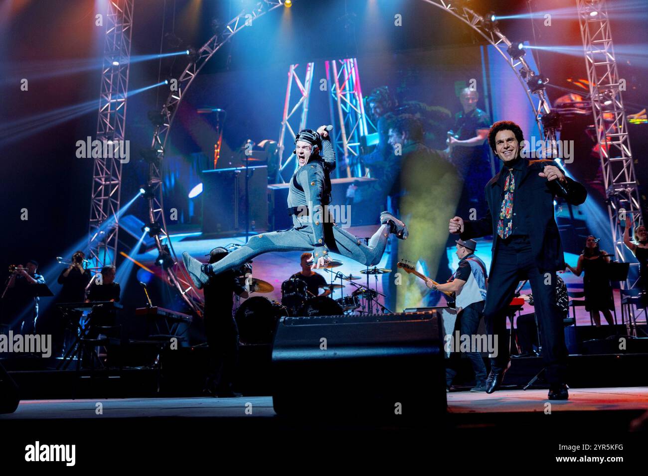 BETTER MAN, from left: Jonno Davies as Robbie Williams, Nick Nicolas as ...