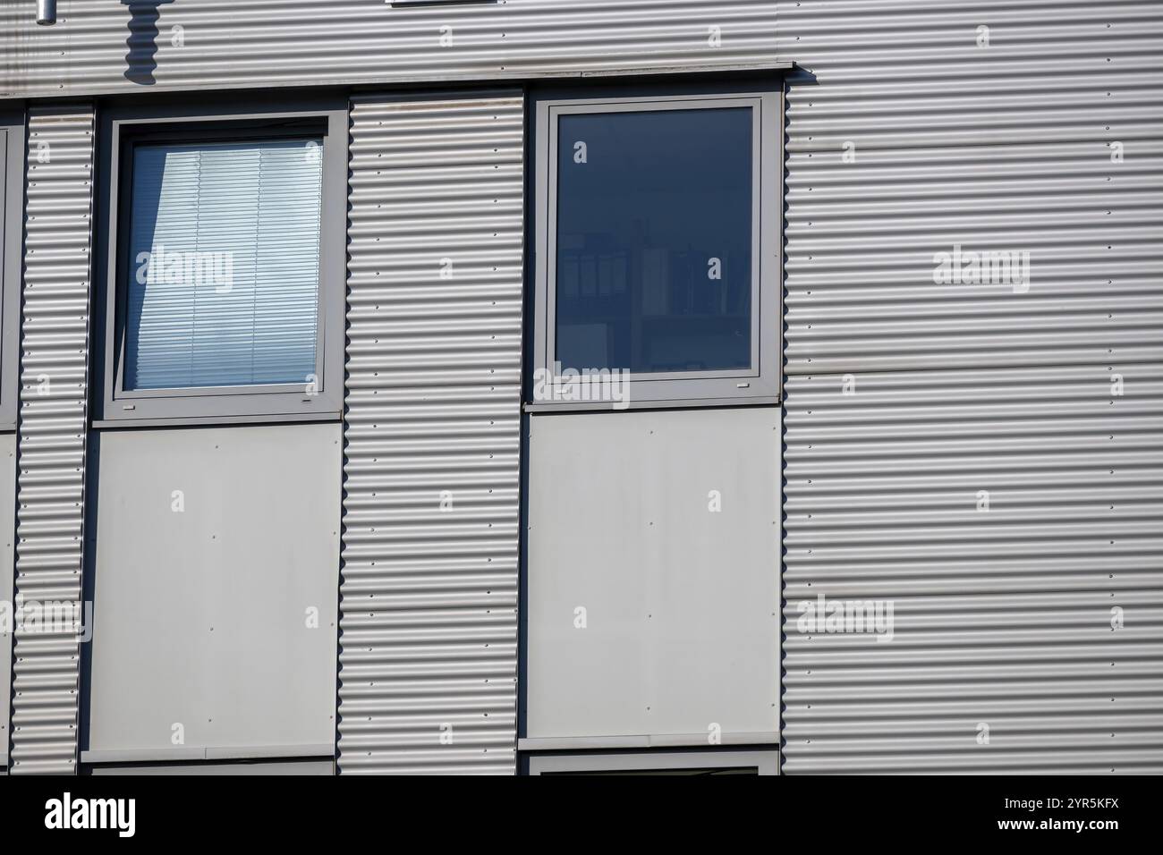 Facade of an modern large house, wall with windows Stock Photo - Alamy