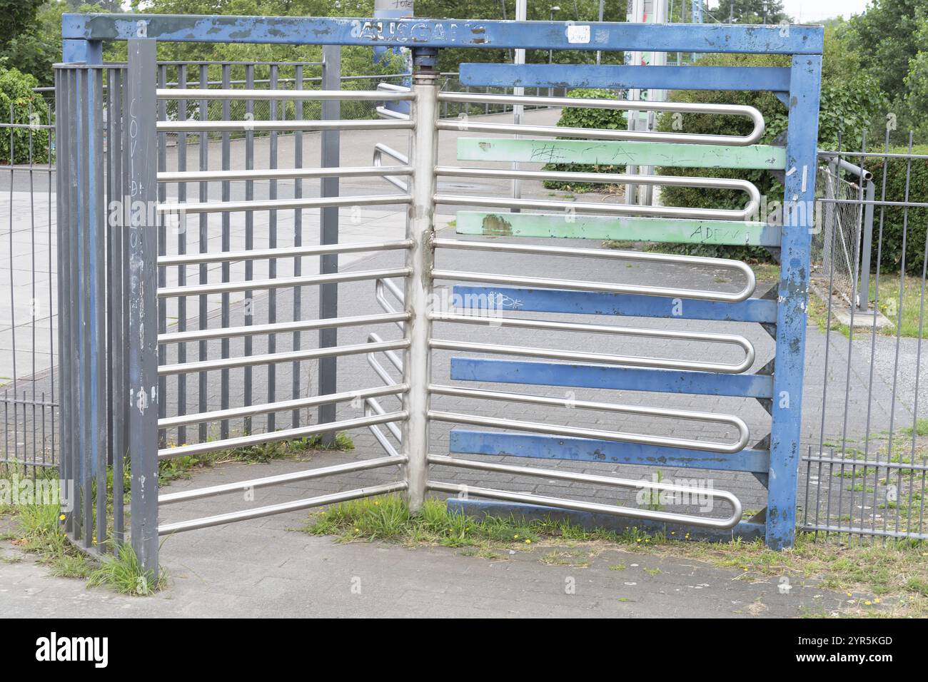 Exit with metal fence at an outdoor area Stock Photo - Alamy
