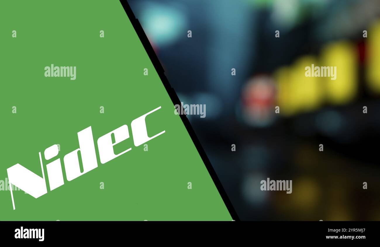 Nidec logo is displayed on smartphone. Nidec Corporation is a Japanese ...