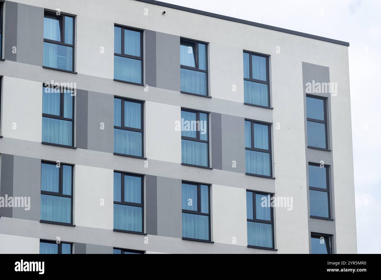 Facade of an modern large house, wall with windows Stock Photo - Alamy