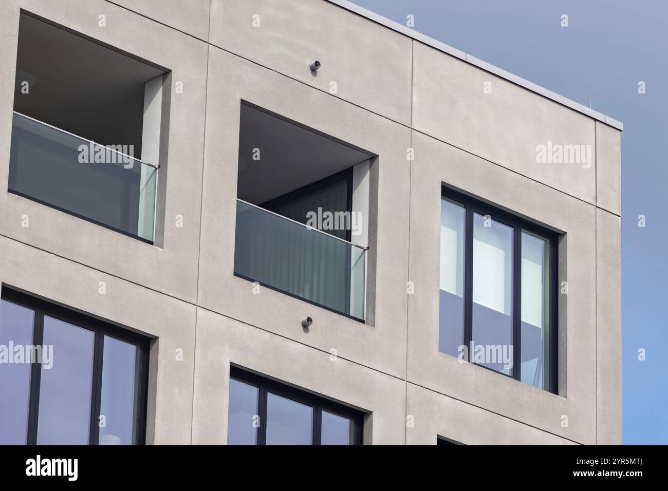 Facade of an modern large house, wall with windows Stock Photo - Alamy