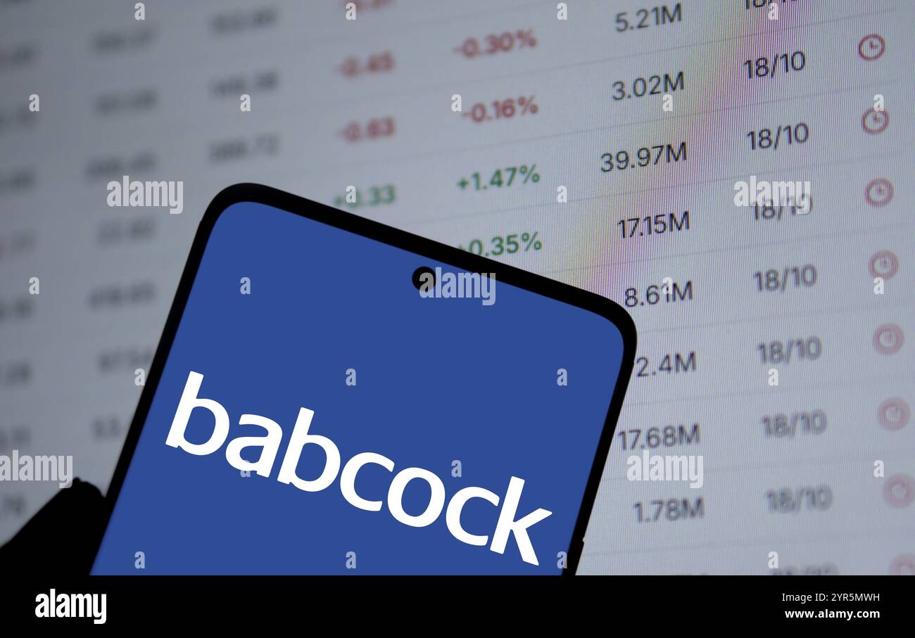 Babcock logo is displayed on smartphone. Babcock International Group ...