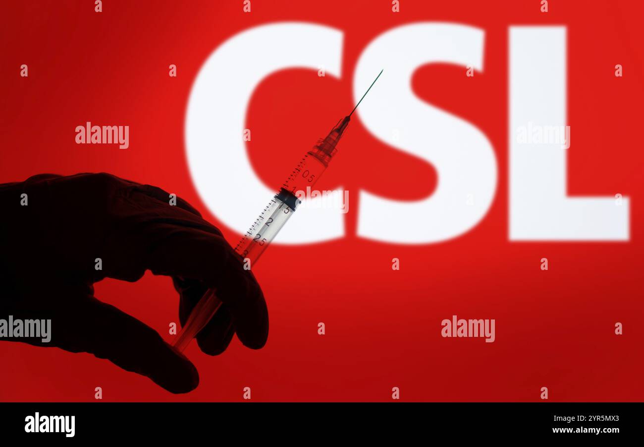 A gloved hand holding a syringe in front of the CSL logo. CSL Limited ...