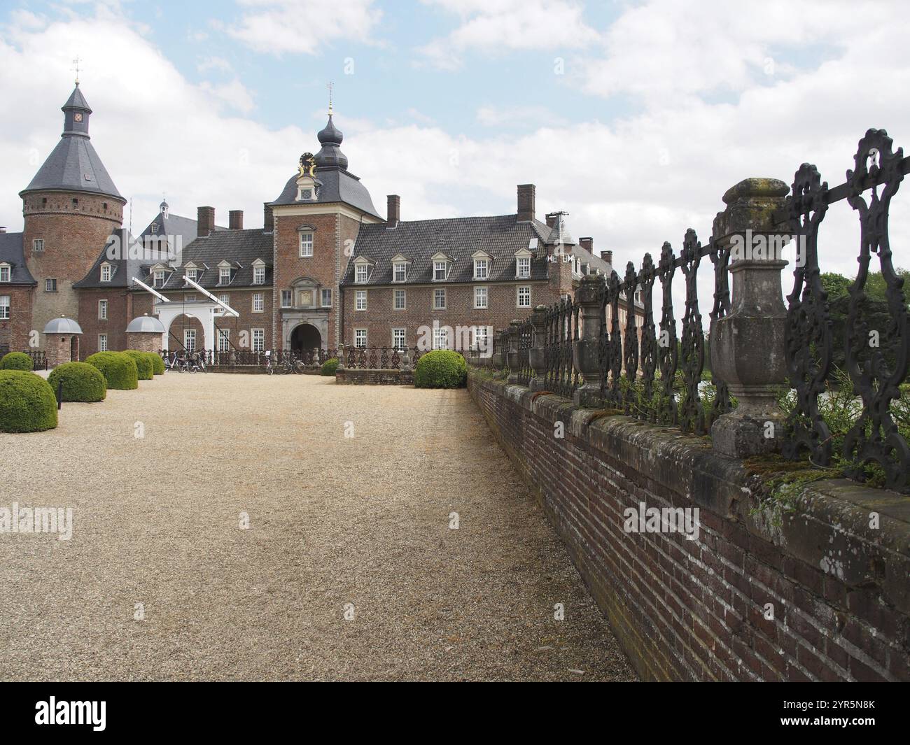 Historic brick castle with towers, surrounded by a well-tended ...