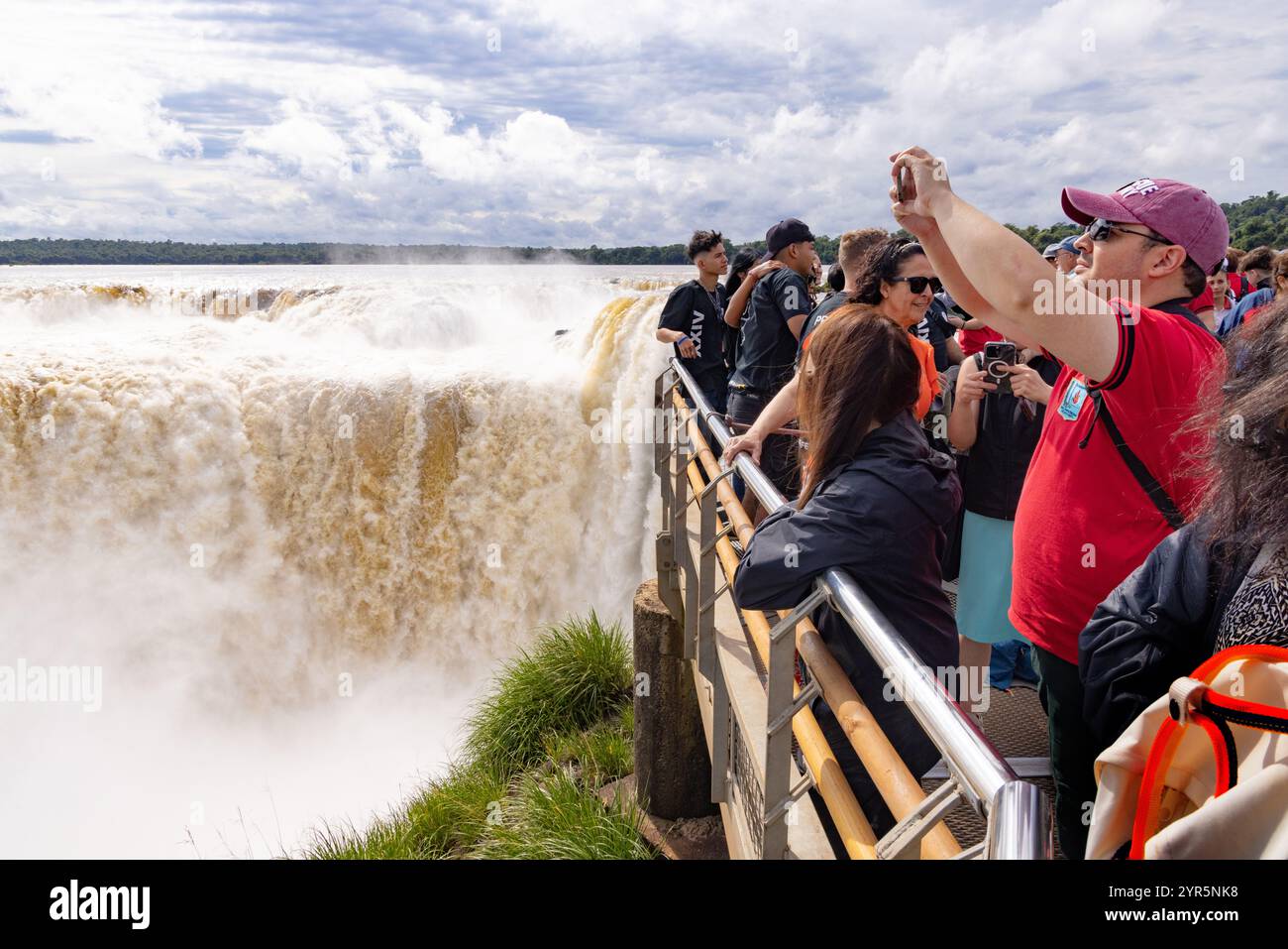 Argentina tourism; Iguazu Falls Argentina side, people on the walkway ...