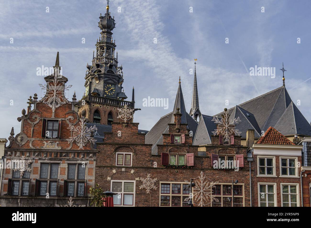 Ornate brick facades and a magnificent bell tower in the historic city ...