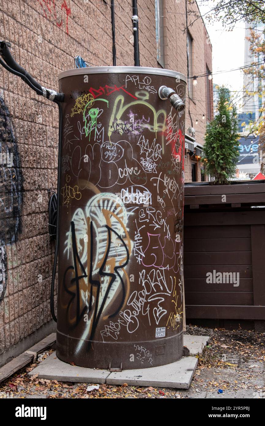 Graffiti tagged on a tank on Renfrew Place in downtown Toronto, Ontario ...