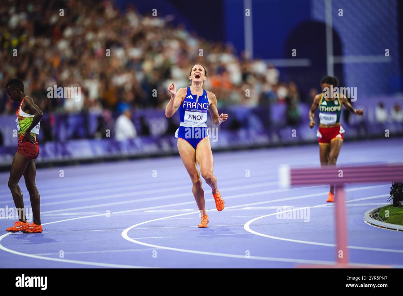Alice Finot participating in the 3000 metres steeplechase at the Paris ...
