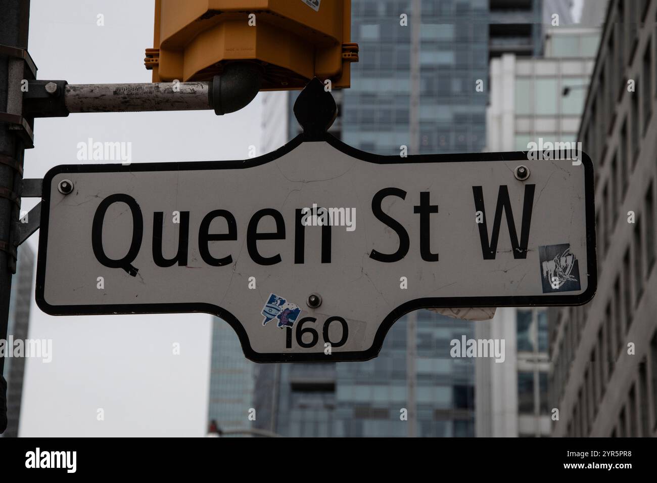 Signs on street light pole hi-res stock photography and images - Alamy
