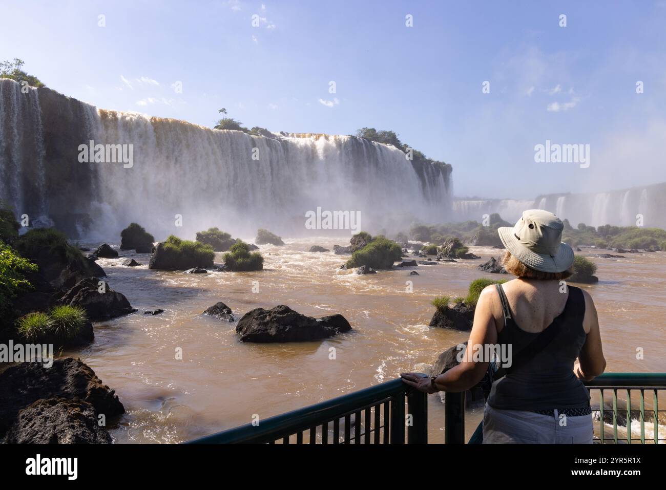 Brazil tourist. One woman at the Iguazu Falls Brazil side of the ...