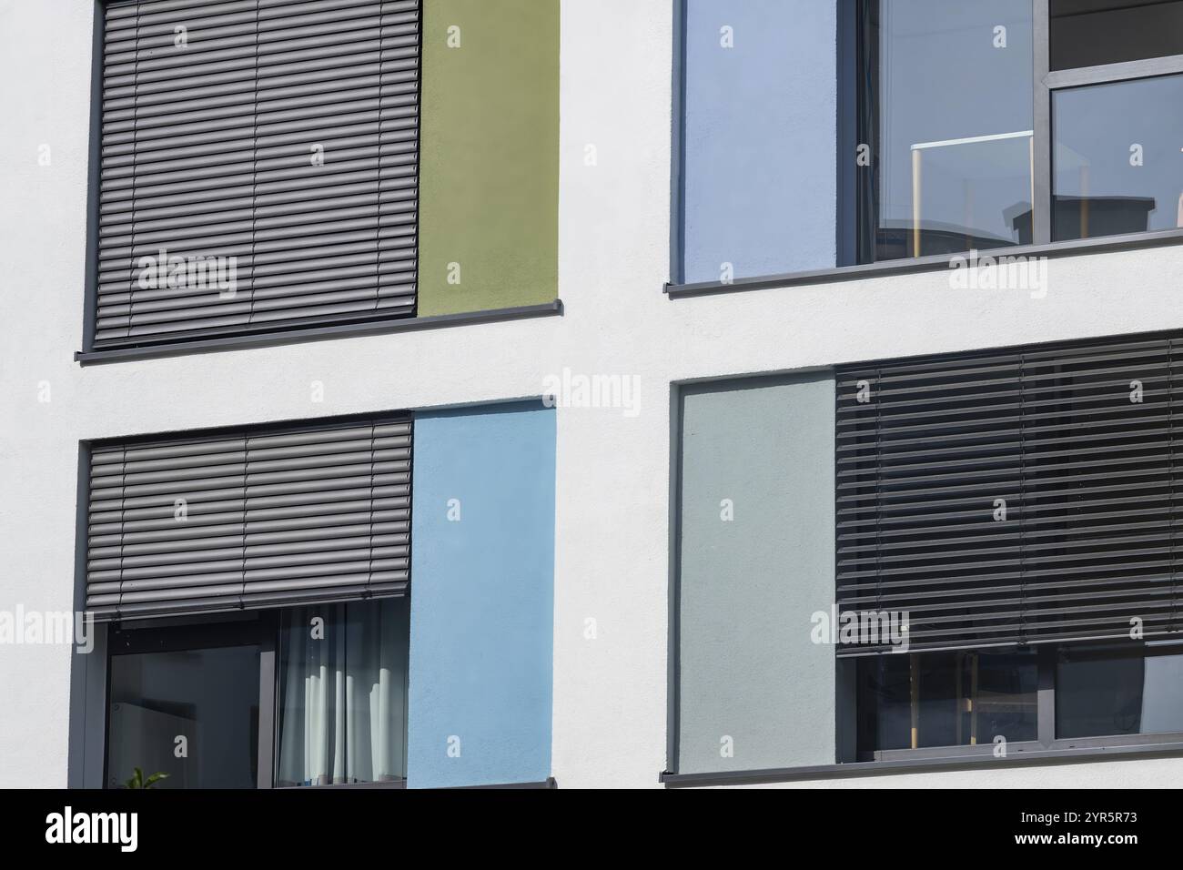 Facade of an modern large house, wall with windows Stock Photo - Alamy