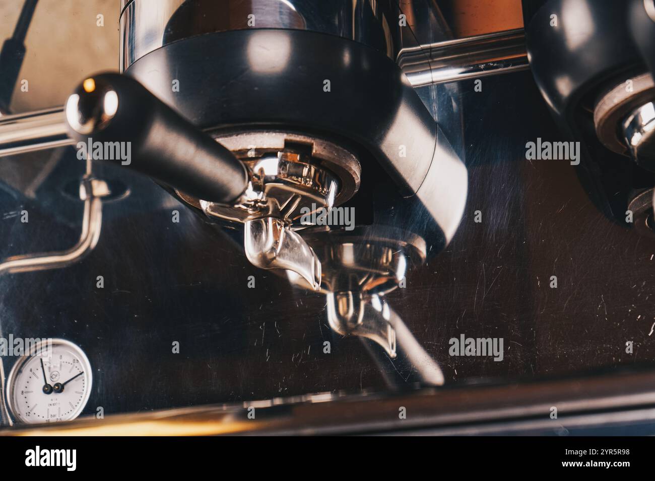 Captured up close, the coffee machine's steam spout adds a touch to its ...