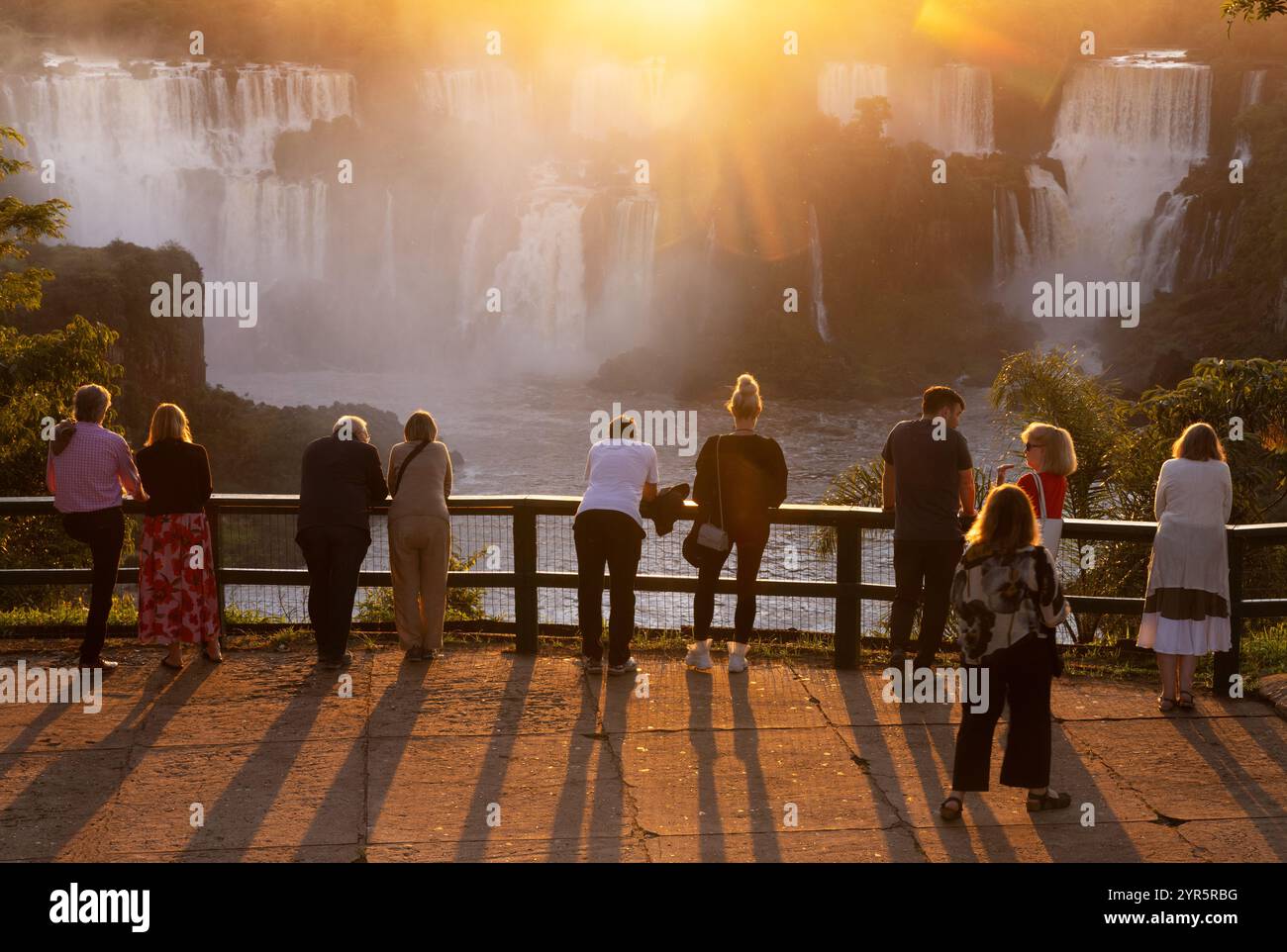 Iguazu Falls sunset; tourists watching sunset from the Iguazu Falls ...