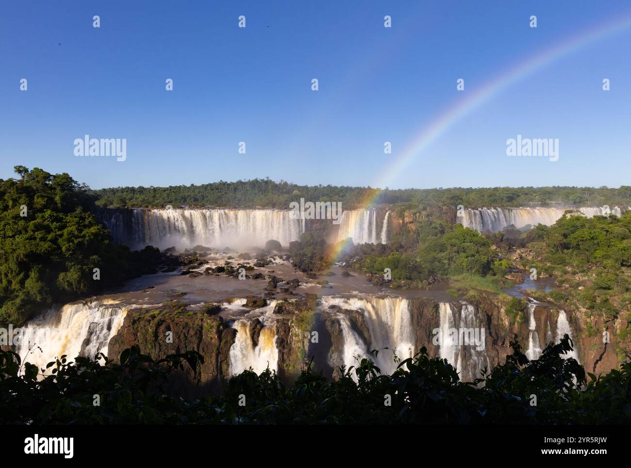 Iguazu Falls rainbow. A rainbow seen over the waterfalls on the Iguacu ...
