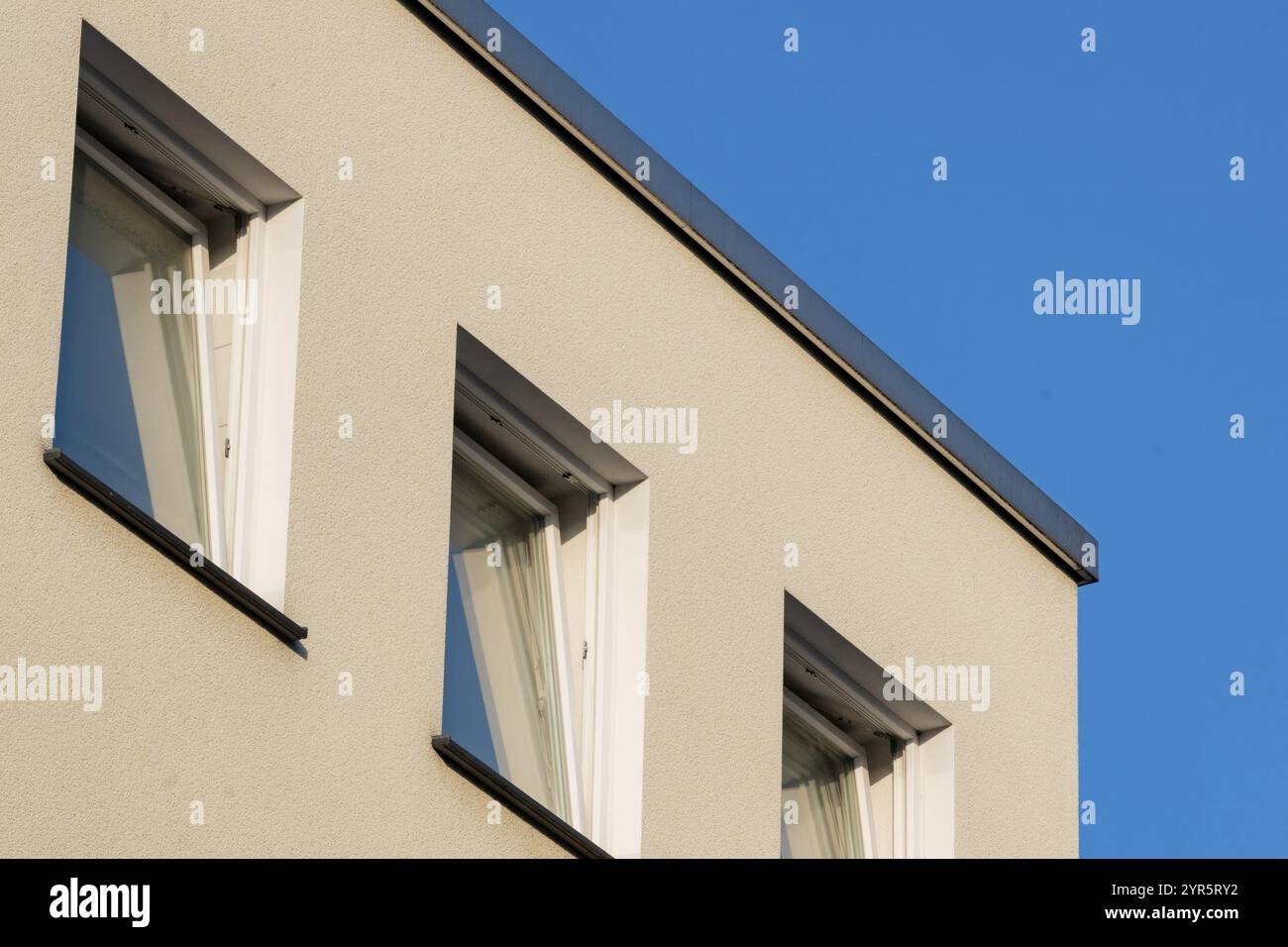 Facade of an modern large house, wall with windows Stock Photo - Alamy