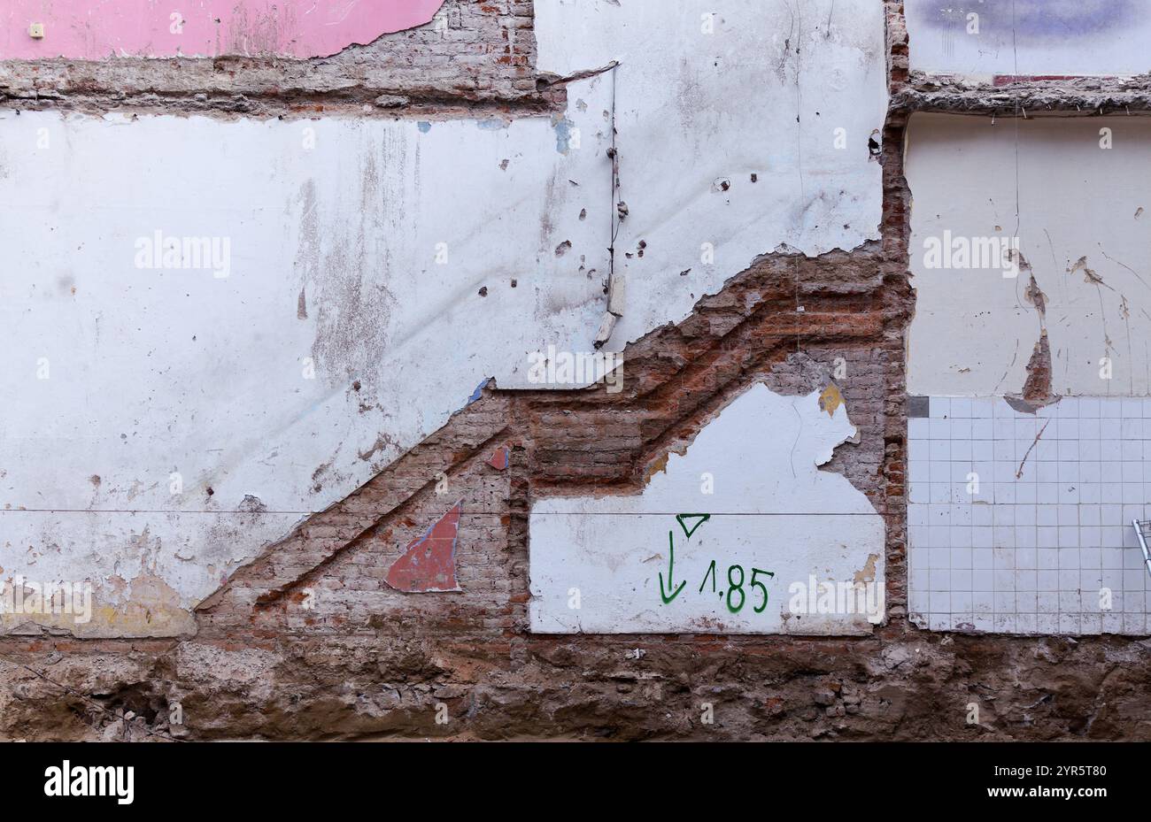 demolition background, side walls of a residential building with traces ...