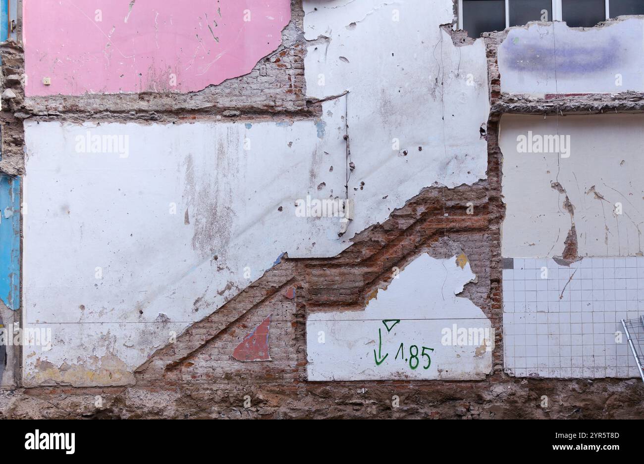 demolition background, side walls of a residential building with traces ...