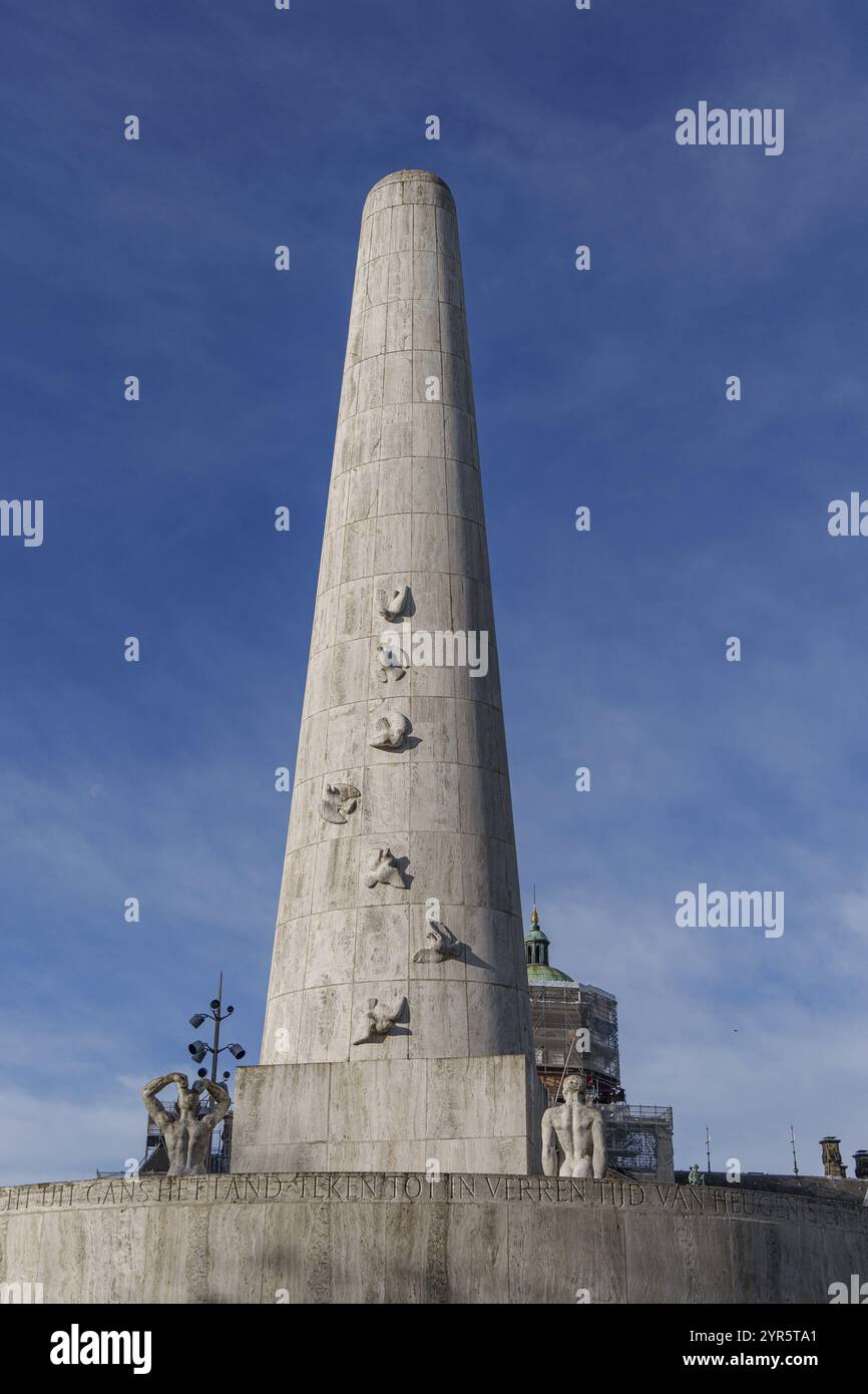 Stone-carved monument with obelisk and sculptures in front of a bright ...