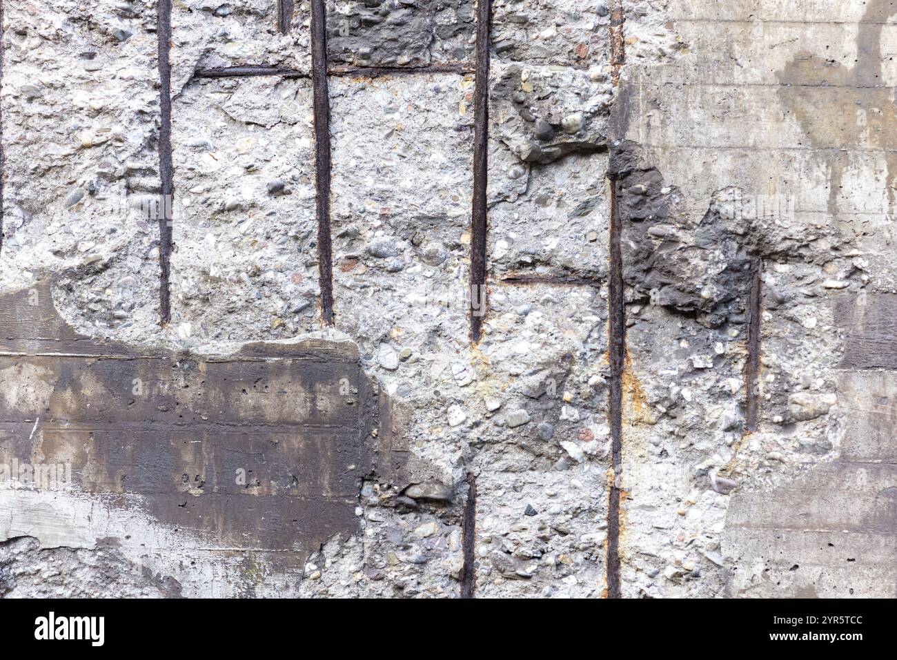 Textured concrete wall with exposed rebar and a rustic look Stock Photo ...