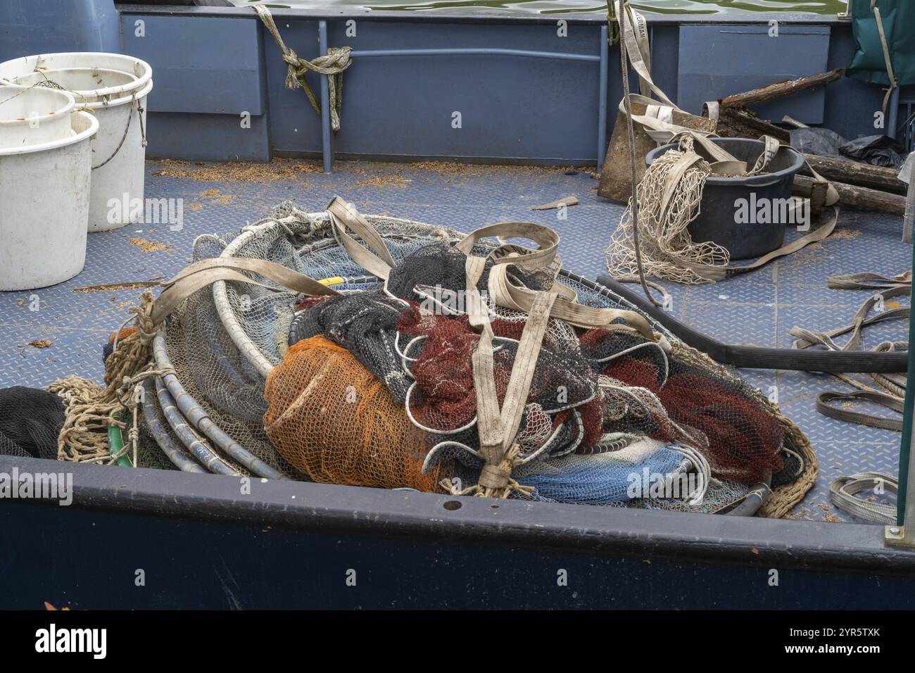 Fishing nets and ropes on a boat Stock Photo - Alamy