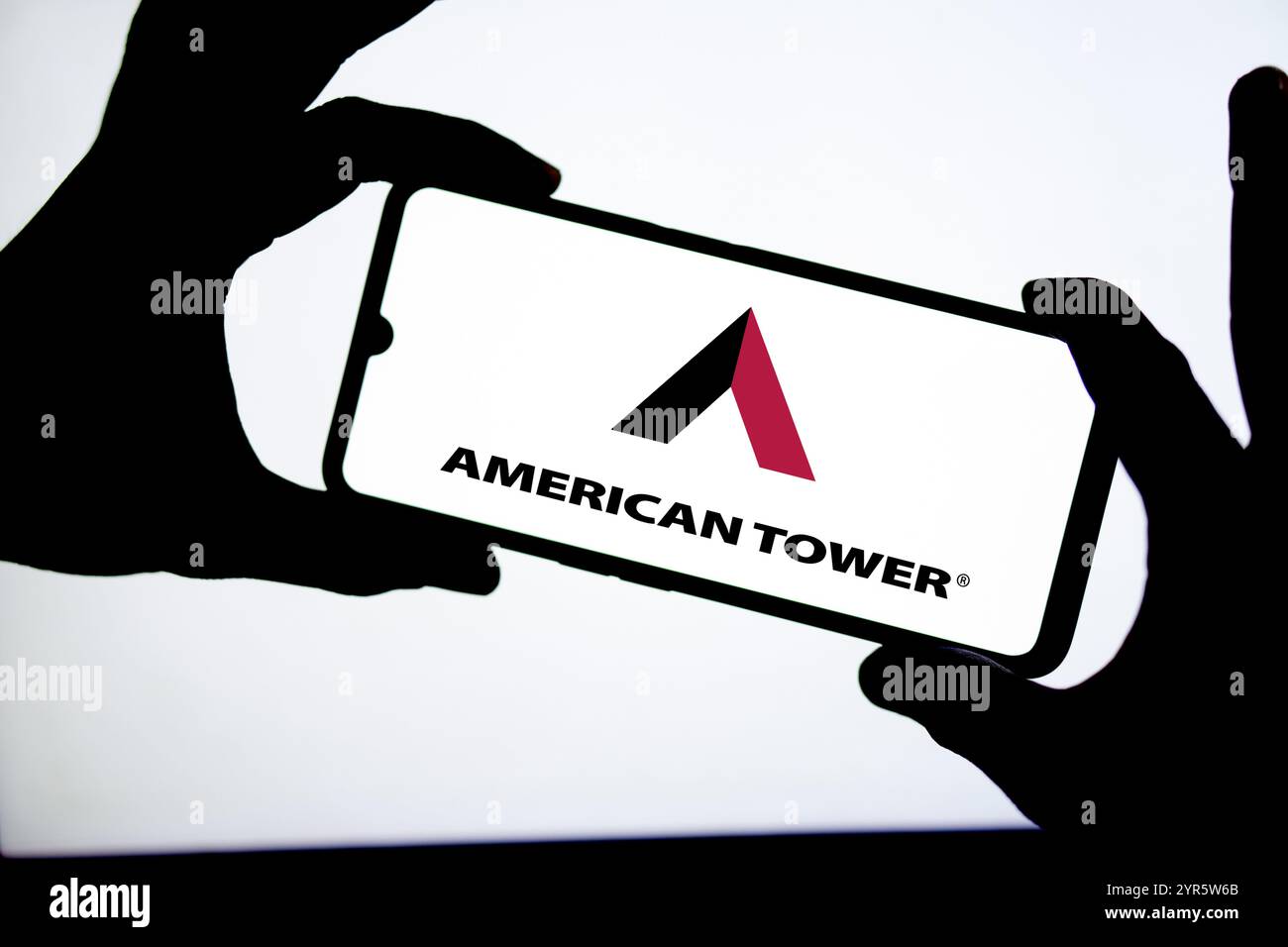 Smartphone with logo of US infrastructure company American Tower Corp ...