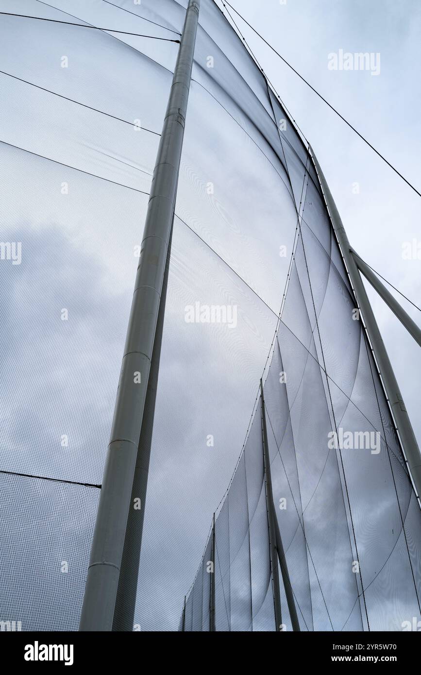 Large poles with metal safety nets Stock Photo - Alamy