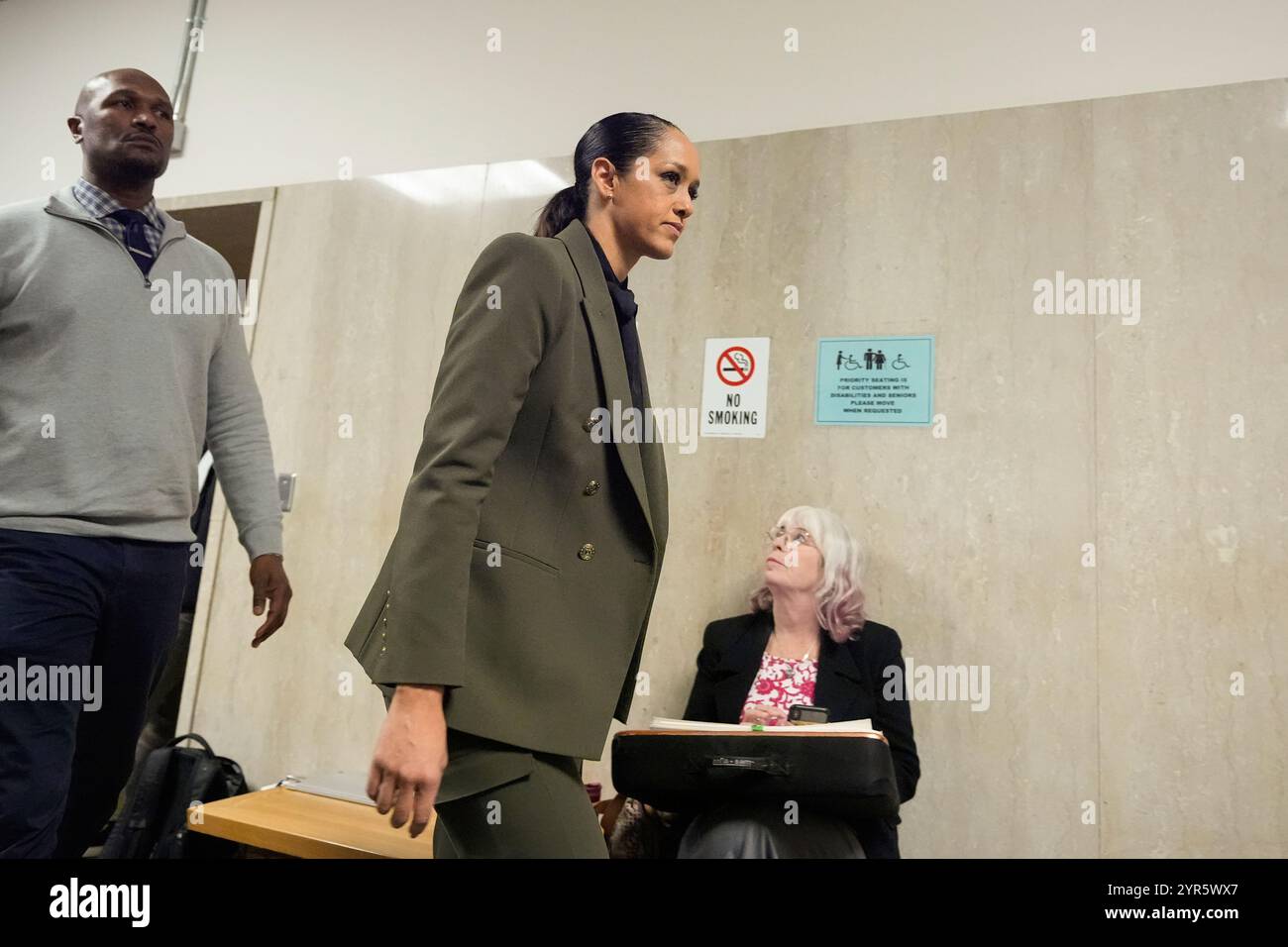 San Francisco district attorney Brooke Jenkins, second from left, walks ...