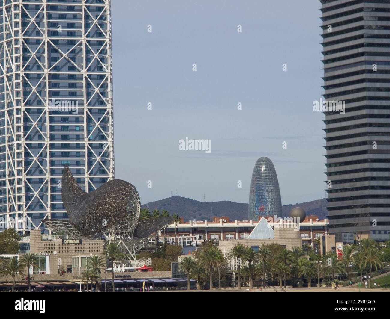 Modern building with eye-catching sculpture and iconic skyscraper ...