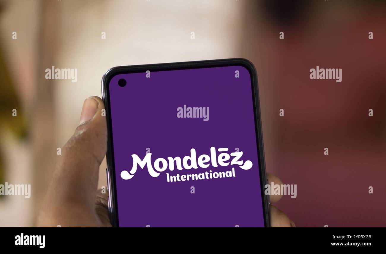 Mondelez international logo is displayed on smartphone. MondelEz ...
