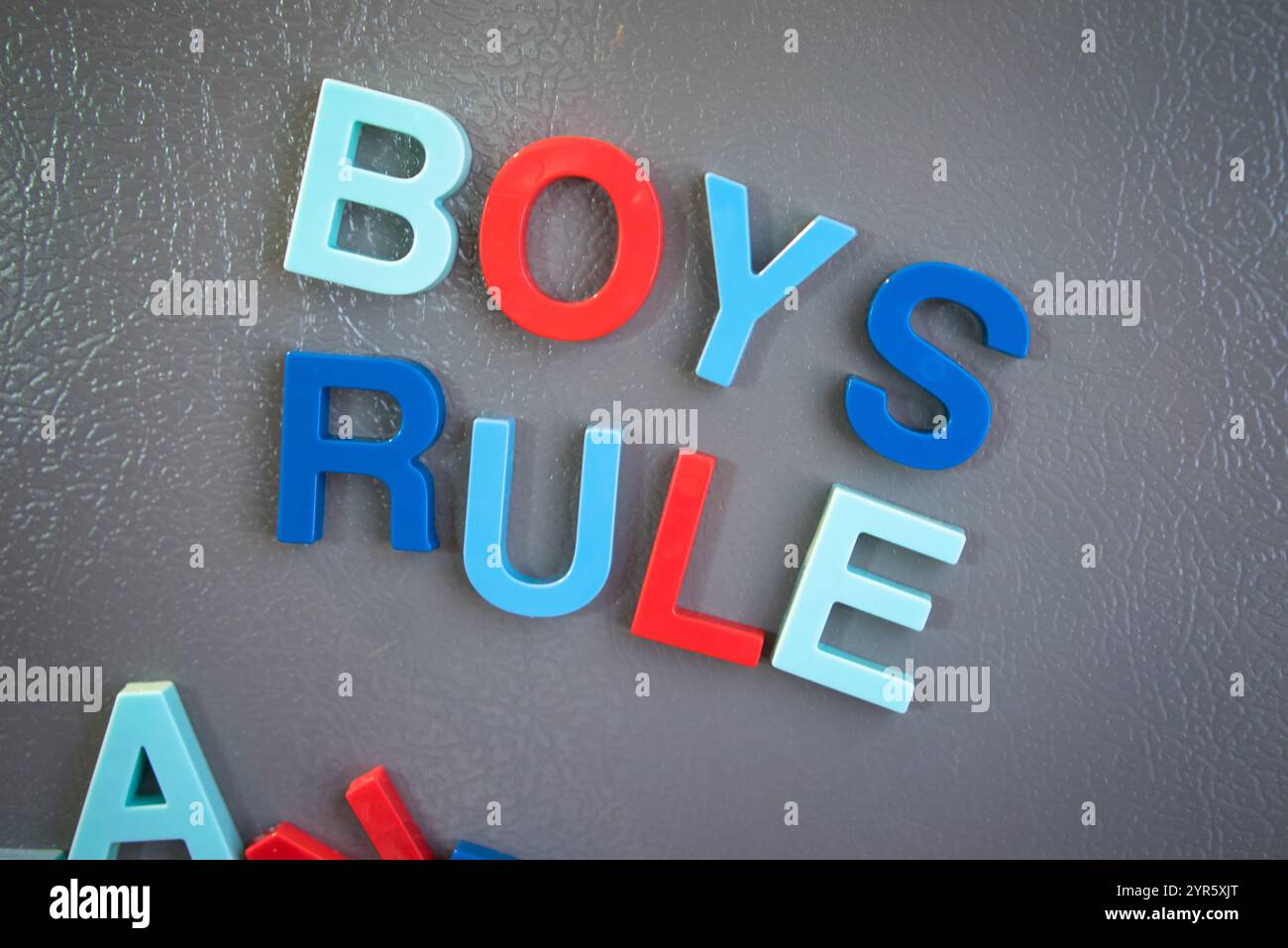 Colorful Magnetic Letters Spell 'Boys Rule' on Refrigerator Door Stock ...