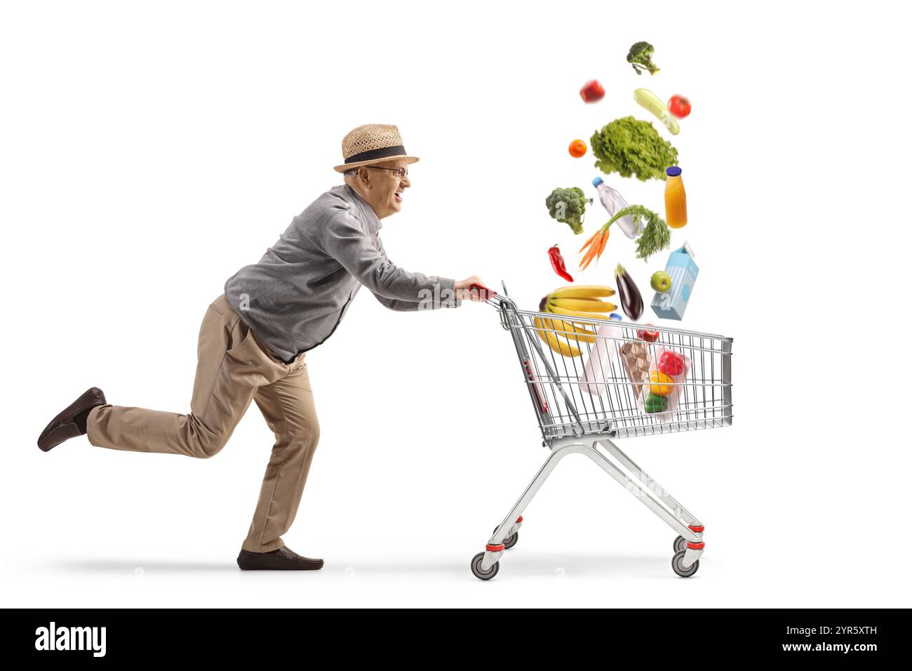 Elderly gentleman running with a shopping cart and falling groceries ...