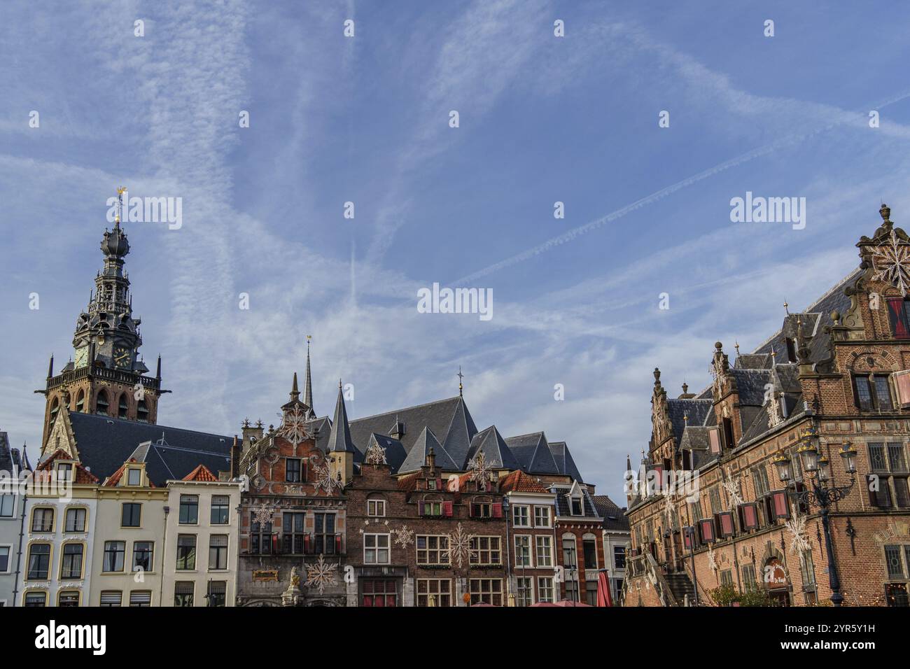 Historic buildings with church tower and detailed facades under a clear ...