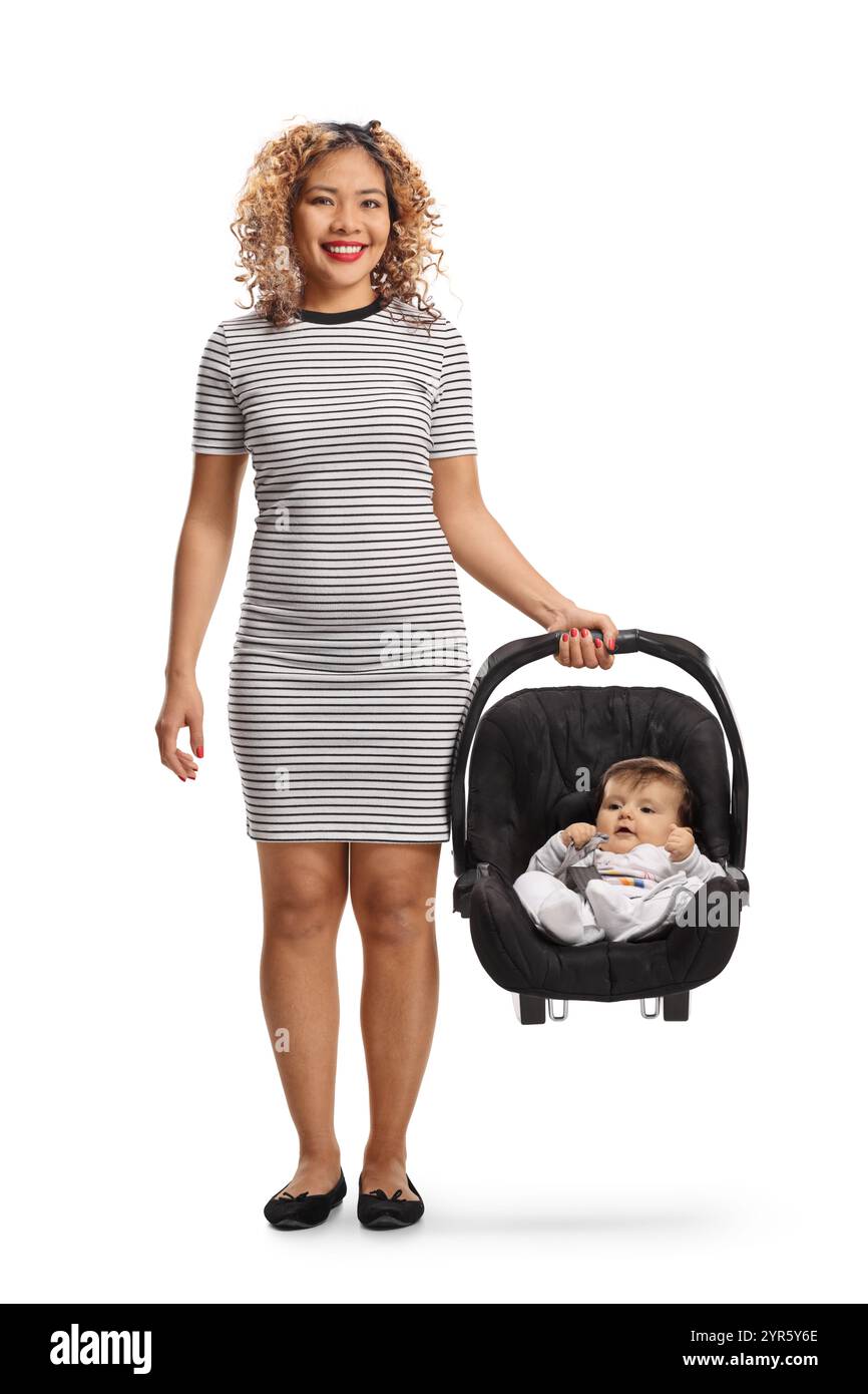 Happy asian woman holding a baby transporting carrier isolated on white ...