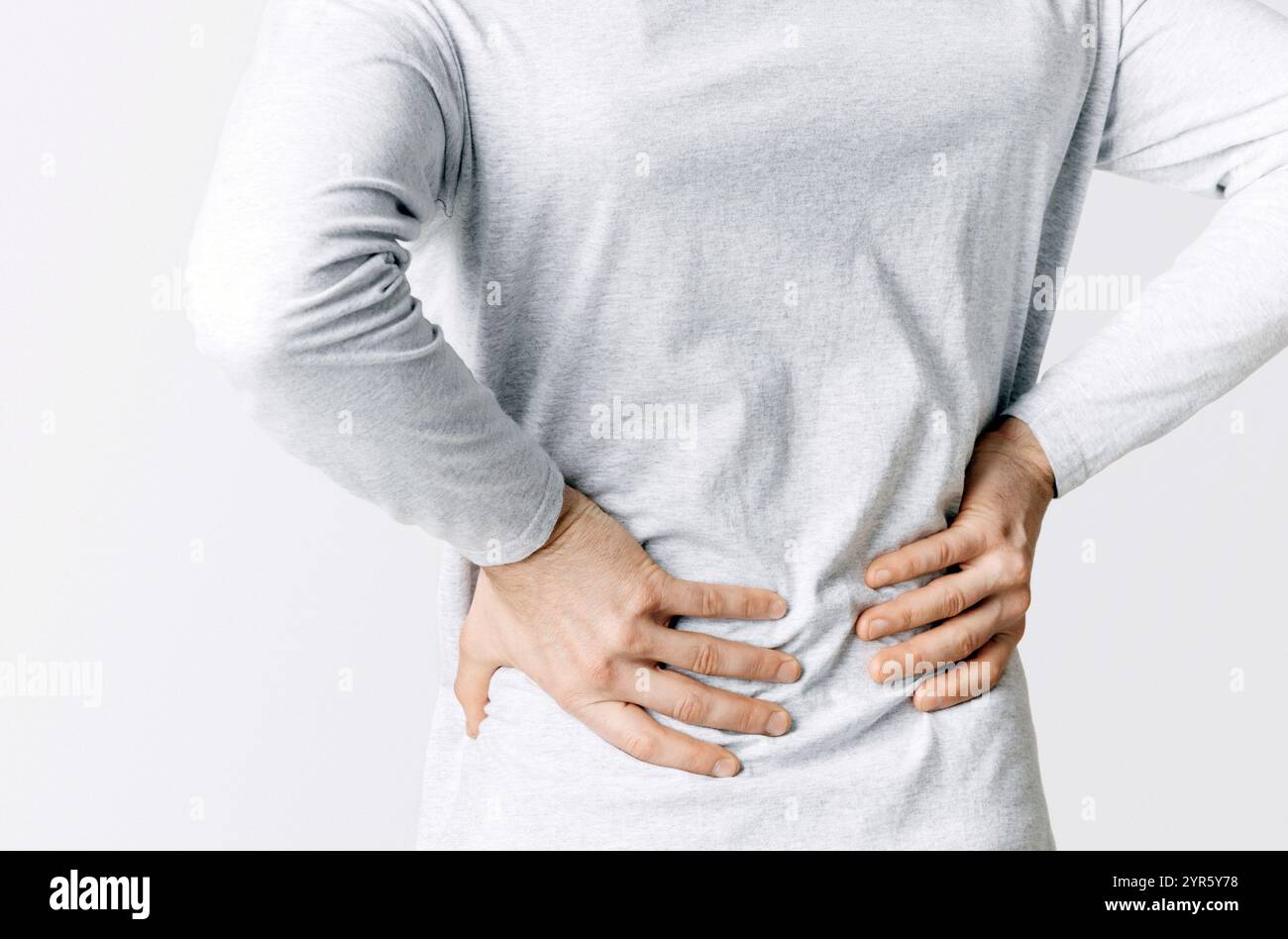 Renal colic and back pain. Man suffers from lower back pain Stock Photo ...