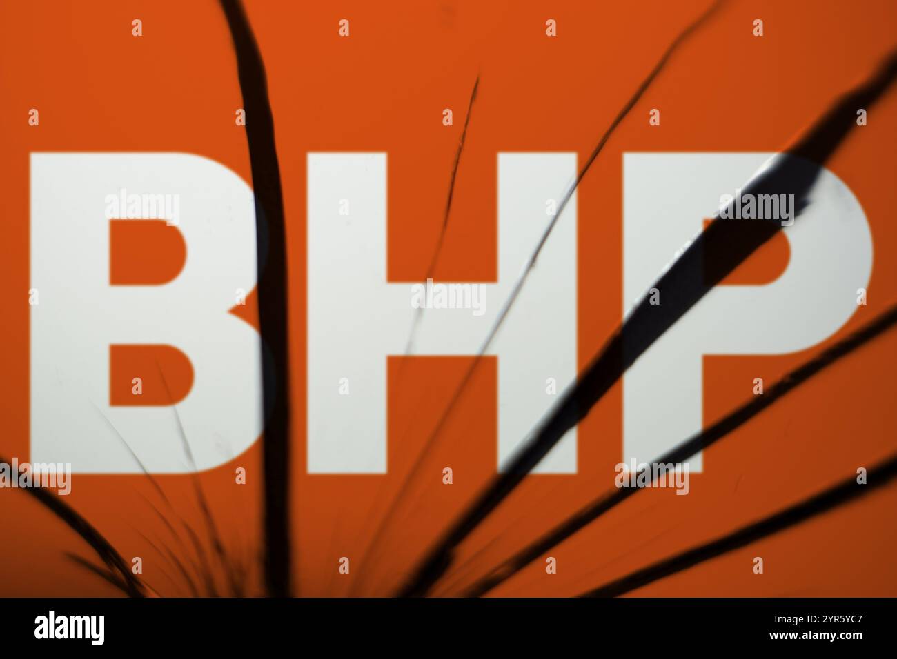 BHP logo is visible on the broken glass. BHP Group Limited is an ...