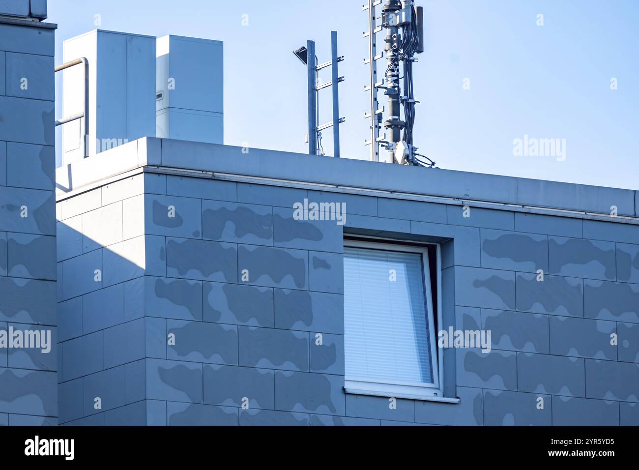 Facade of an modern large house, wall with windows Stock Photo - Alamy