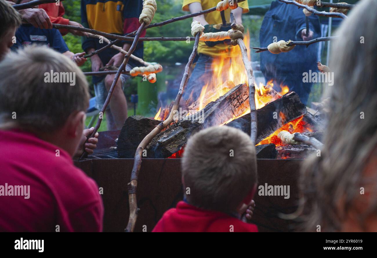 Stick bread over campfire hi-res stock photography and images - Alamy
