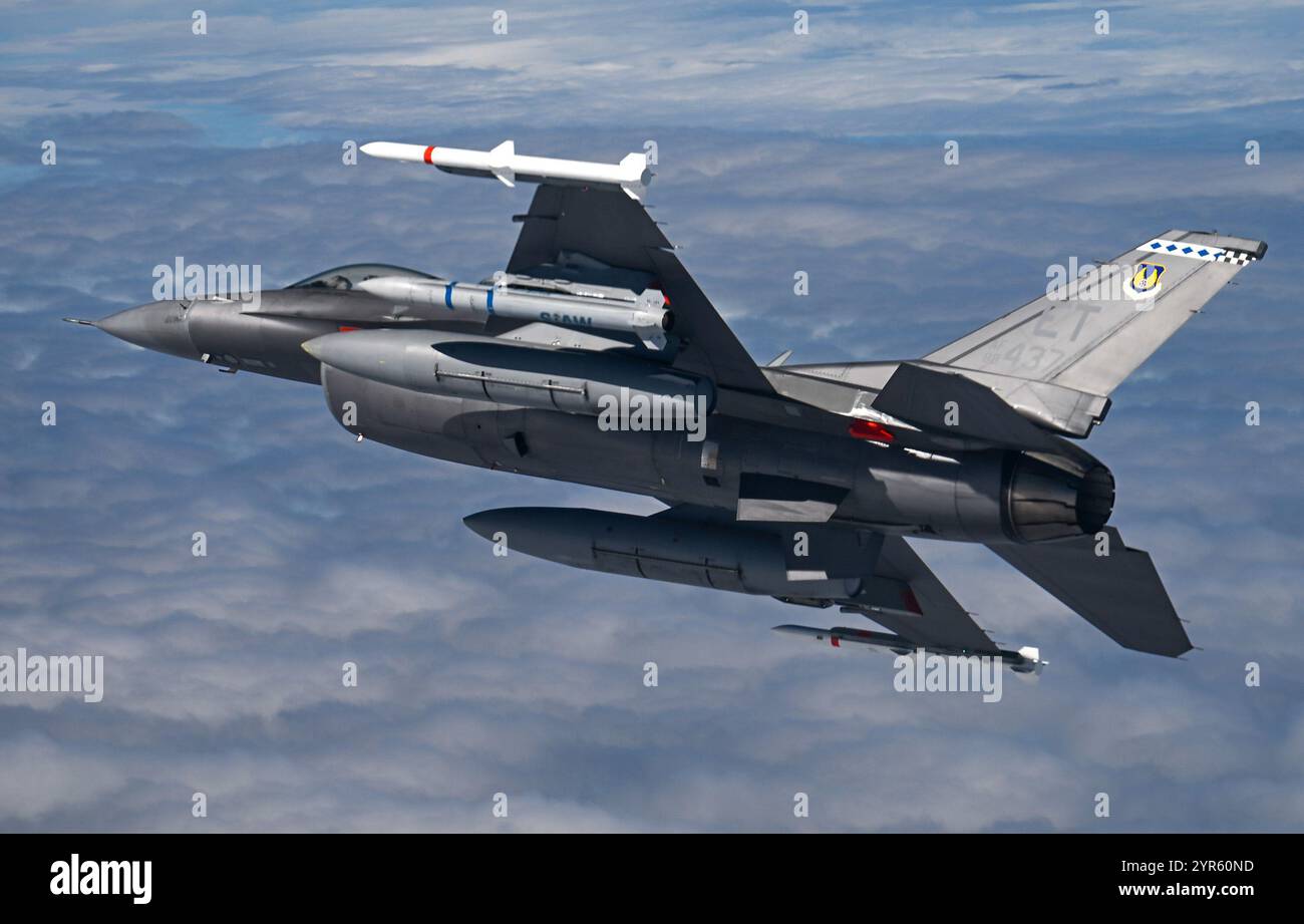 A 40th Flight Test Squadron F-16 Fighting Falcon flies with a Stand-in ...