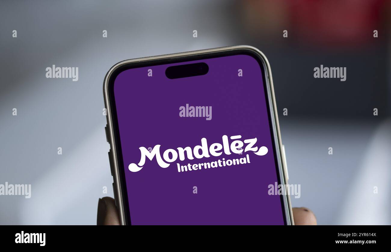 Mondelez international logo is displayed on smartphone. MondelEz ...