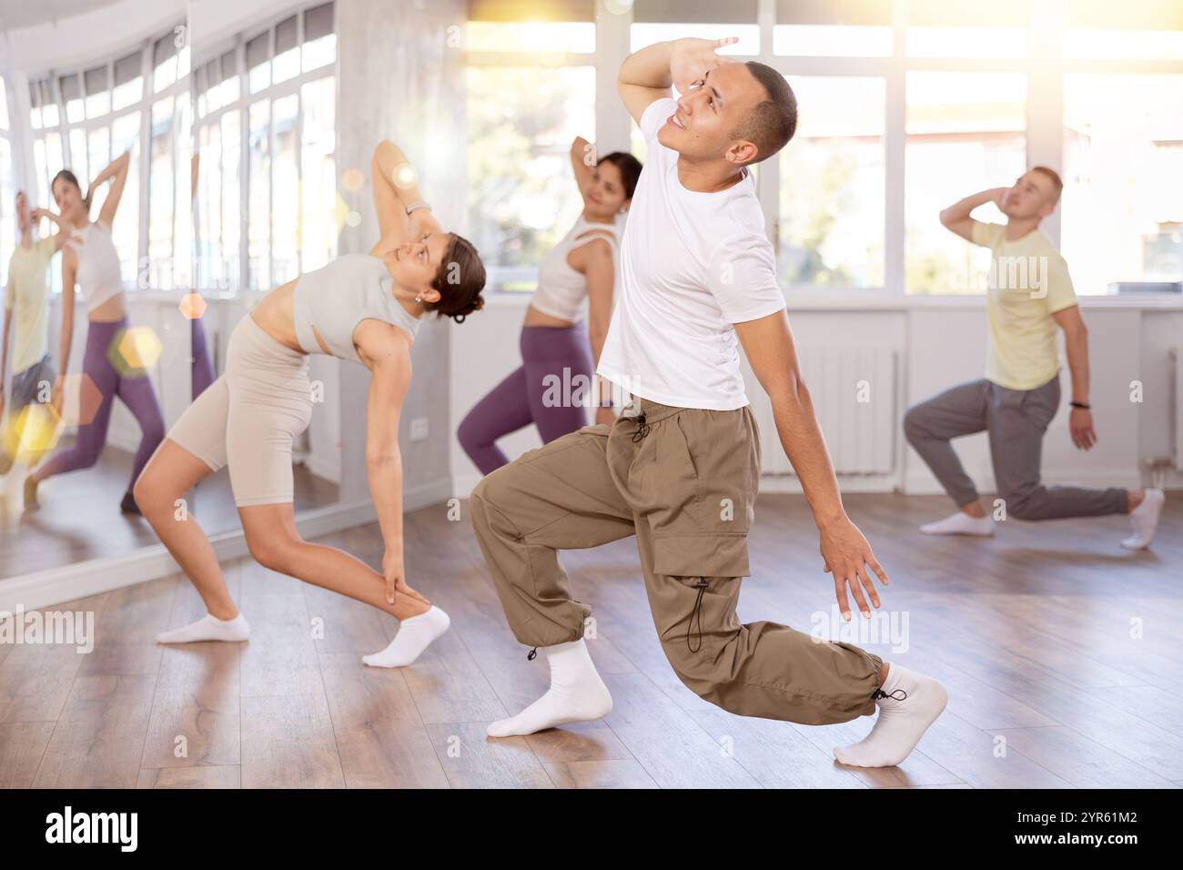 Expressive Asian guy honing hip-hop dance moves in studio Stock Photo ...